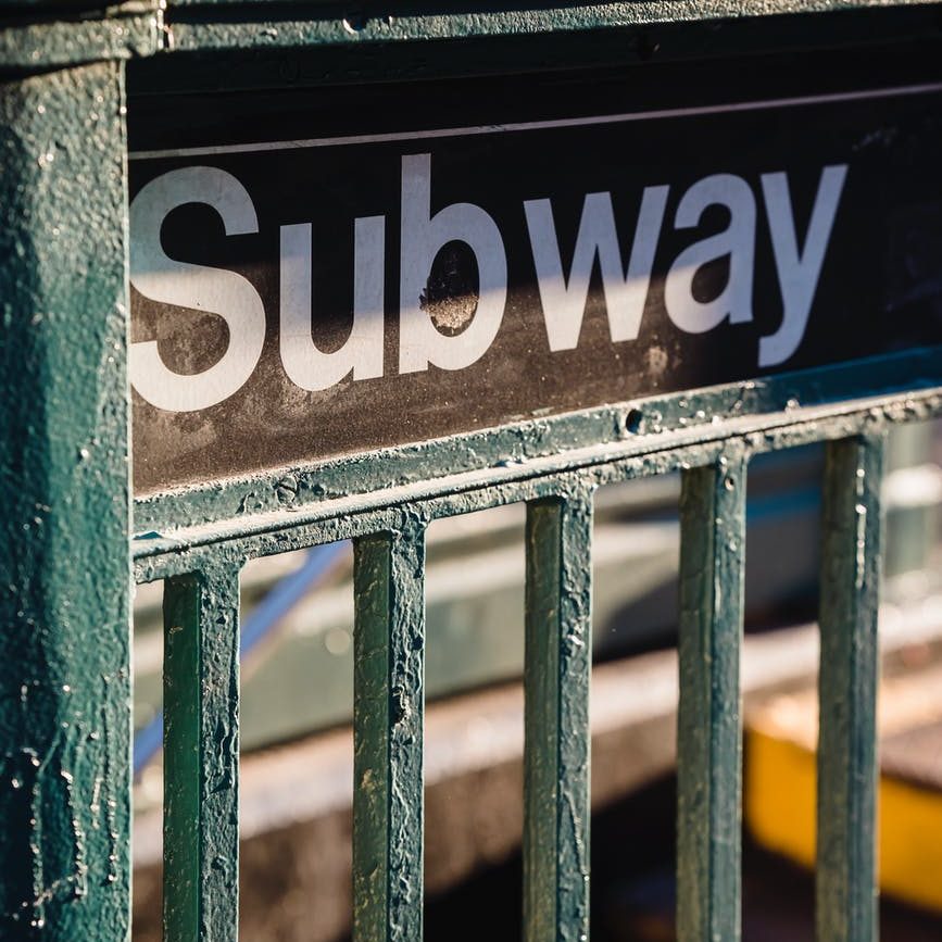 metal railing with inscription subway – Bound by the Cloak